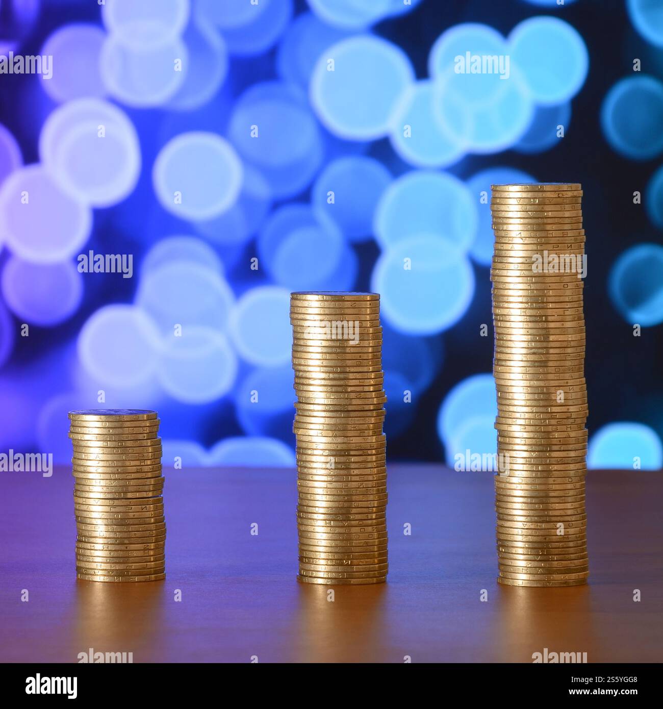 Golden coin stacks arranged as a graph. Increasing columns of coins ...