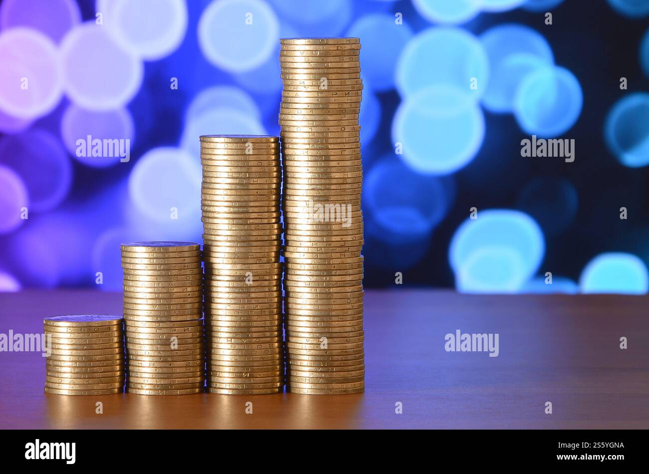 Golden coin stacks arranged as a graph. Increasing columns of coins ...