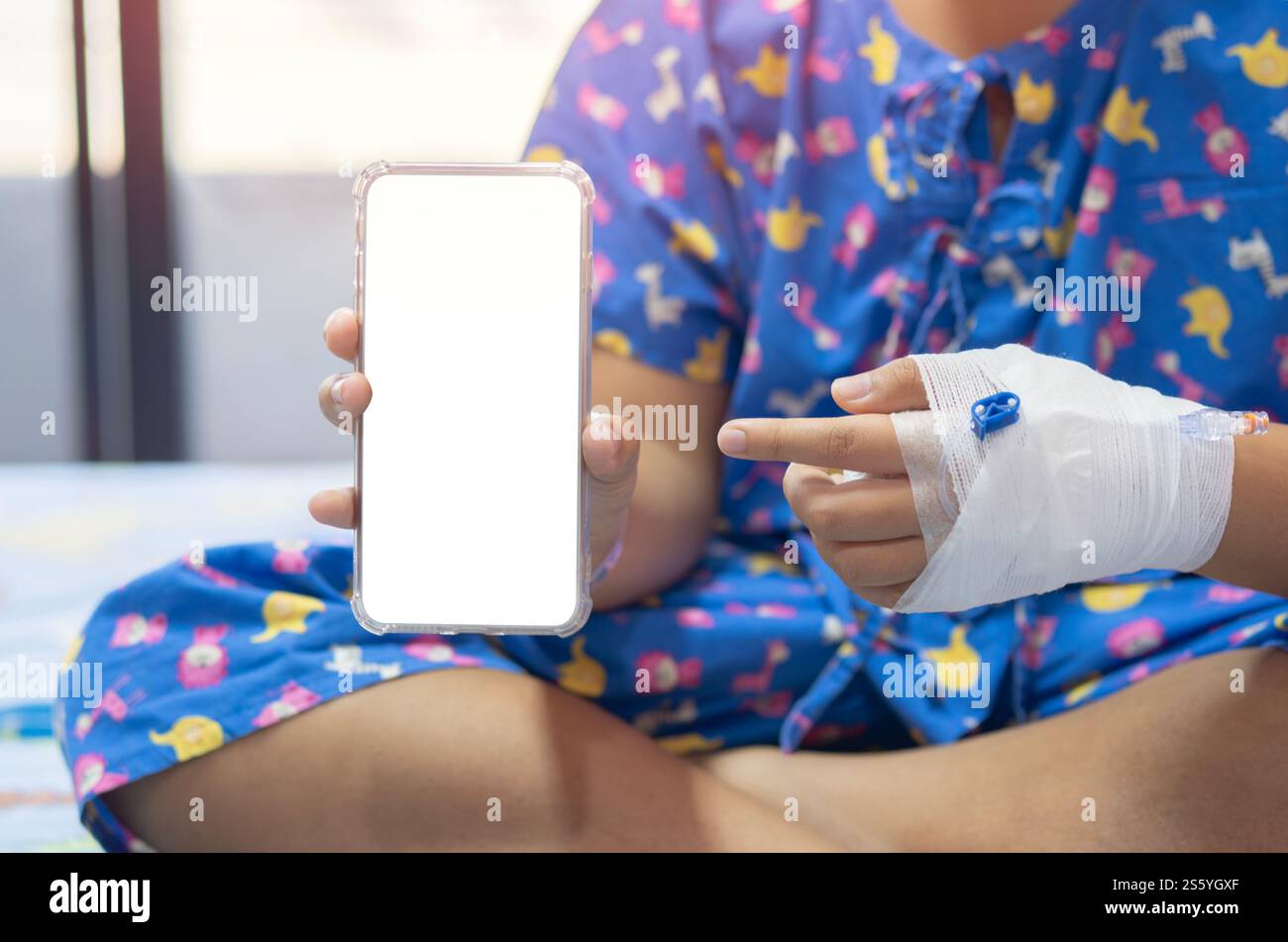 Shot of patient boy hands receiving intravenous fluid directly into a ...