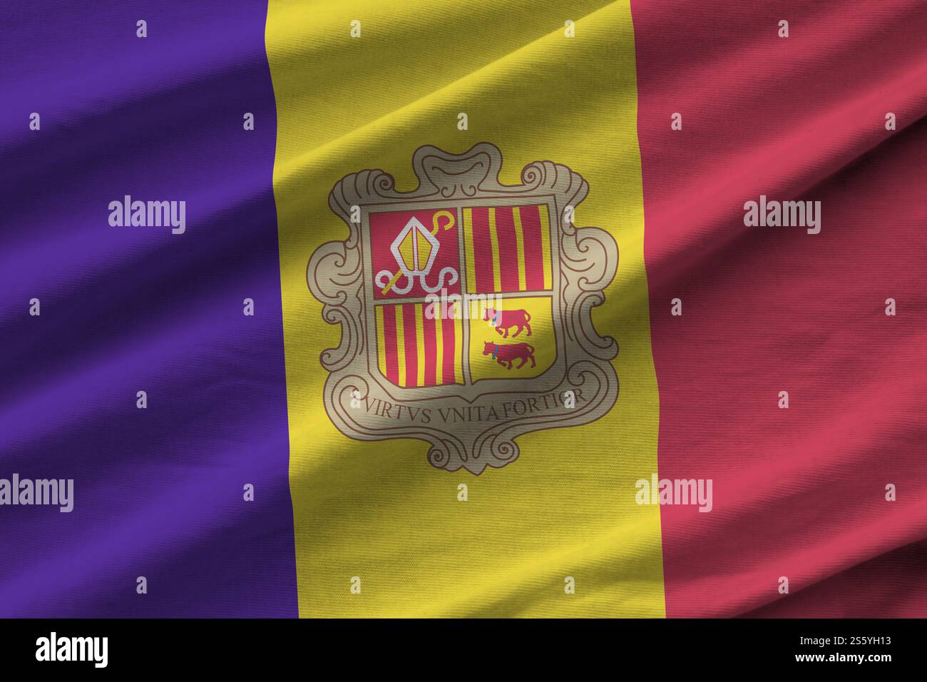 Andorra flag with big folds waving close up under the studio light ...