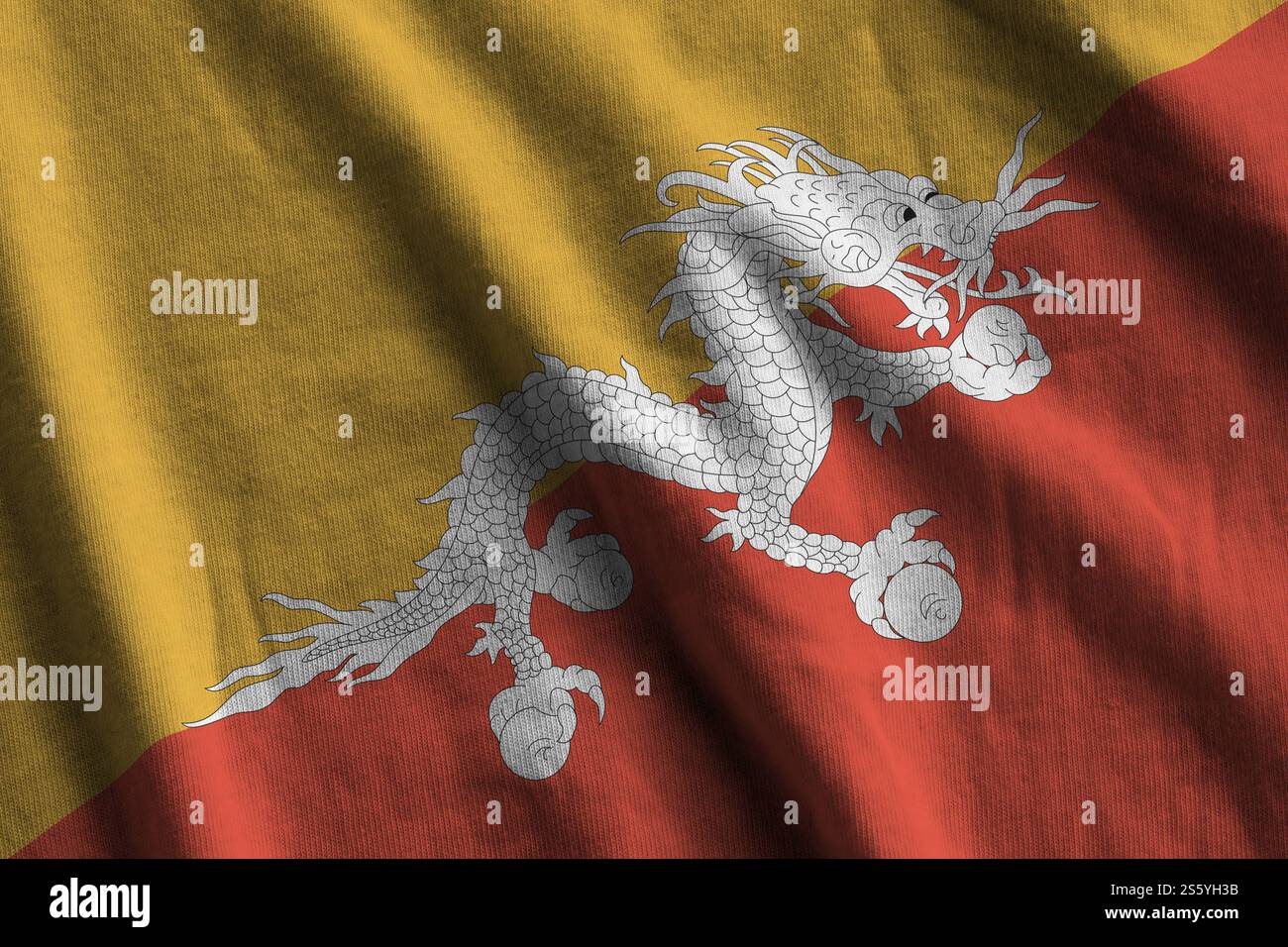 Bhutan flag with big folds waving close up under the studio light ...