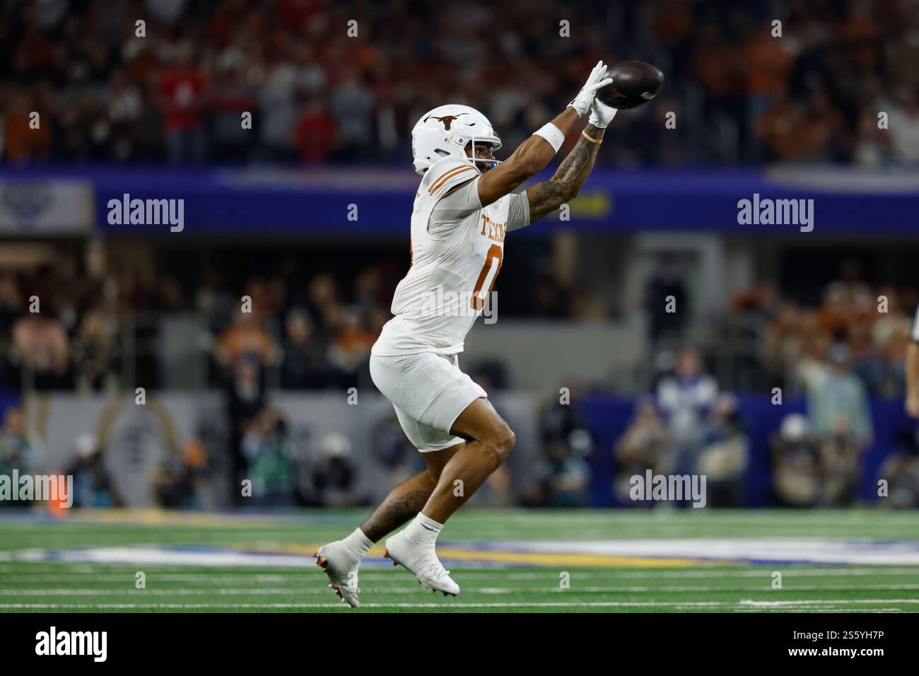 University of Texas wide receiver DeAndre Moore Jr. (0) catches a pass ...