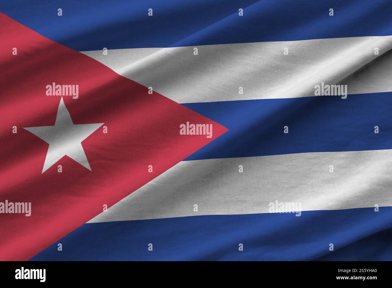 Cuba flag with big folds waving close up under the studio light indoors ...