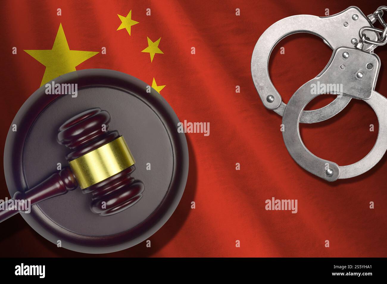 China flag with judge mallet and handcuffs in dark room. Concept of ...