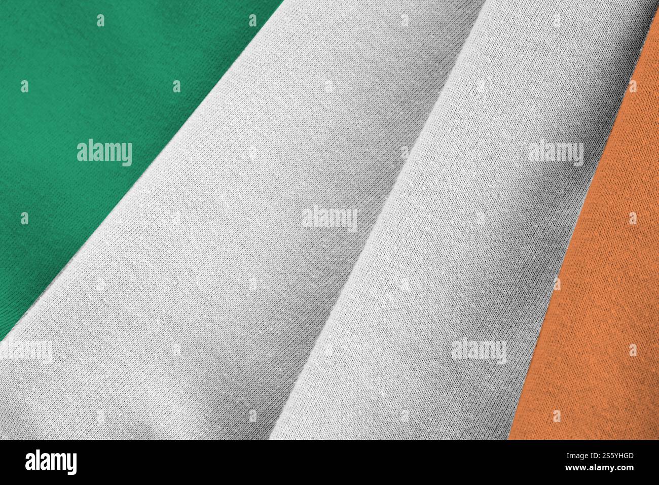 Ireland flag with big folds waving close up under the studio light ...