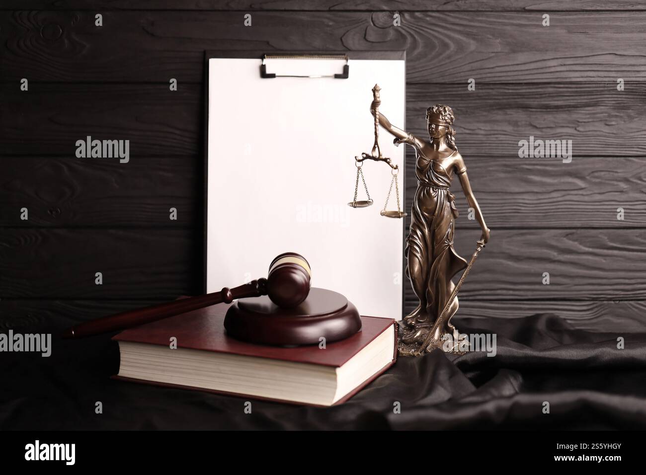 Lady justice or justitia the Roman goddess of Justice. Statue on brown ...
