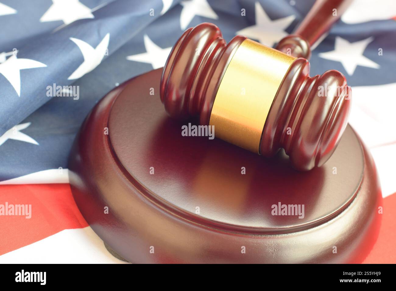 Justice mallet on United States flag in a courtroom during a judicial ...