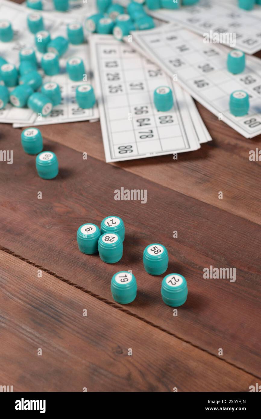 Many barrels with numbers and cards for lotto or russian bingo table ...