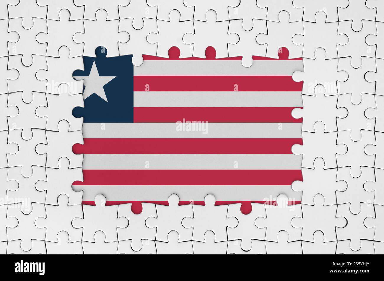 Liberia flag in frame of white puzzle pieces with missing central parts ...