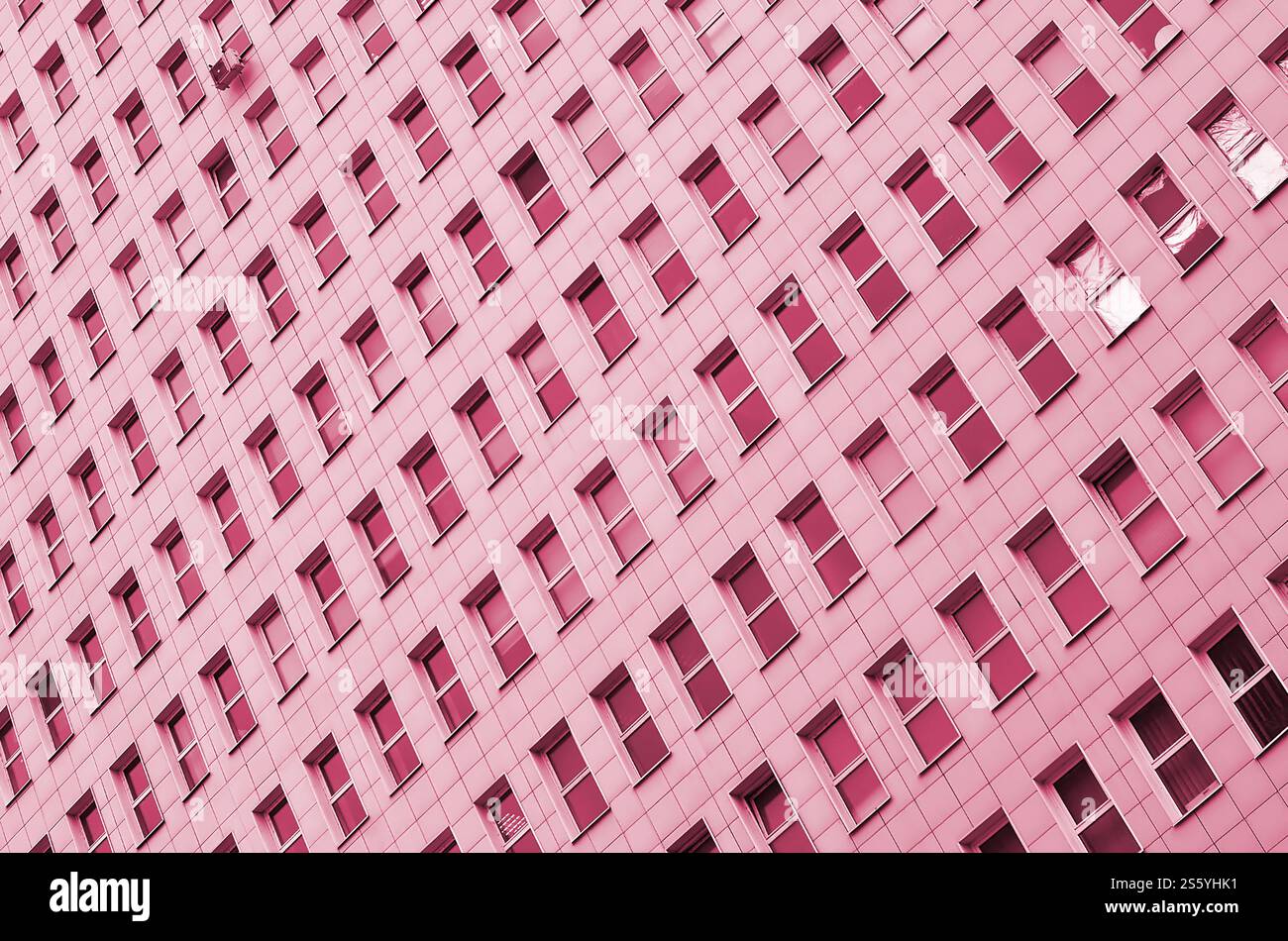 A pattern of many windows from a multi-storey office building. A large ...