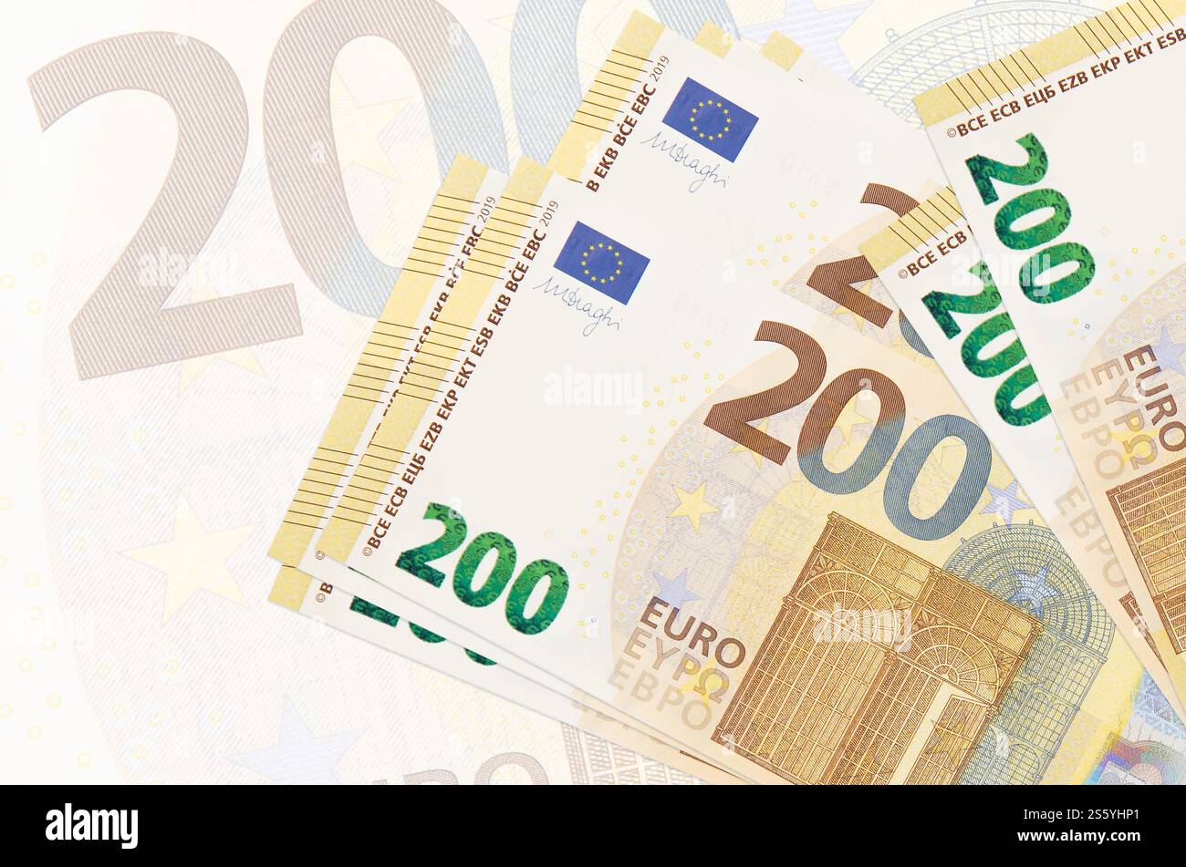 200 euro bills lies in stack on background of big semi-transparent ...
