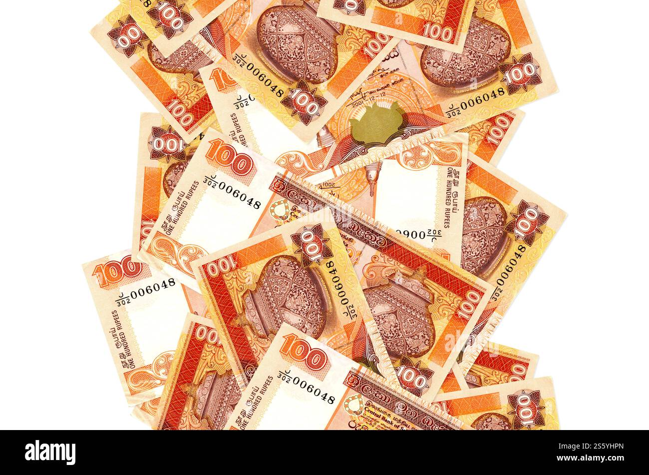 100 Sri Lankan rupees bills flying down isolated on white. Many banknotes falling with white ...