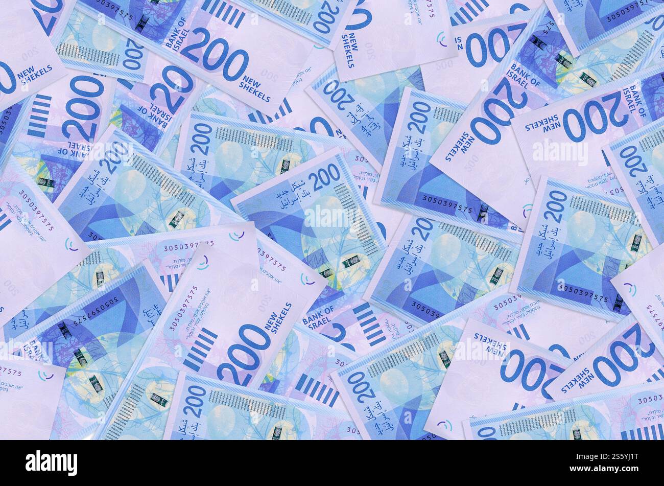 200 Israeli new shekels bills lies in big pile. Rich life conceptual ...