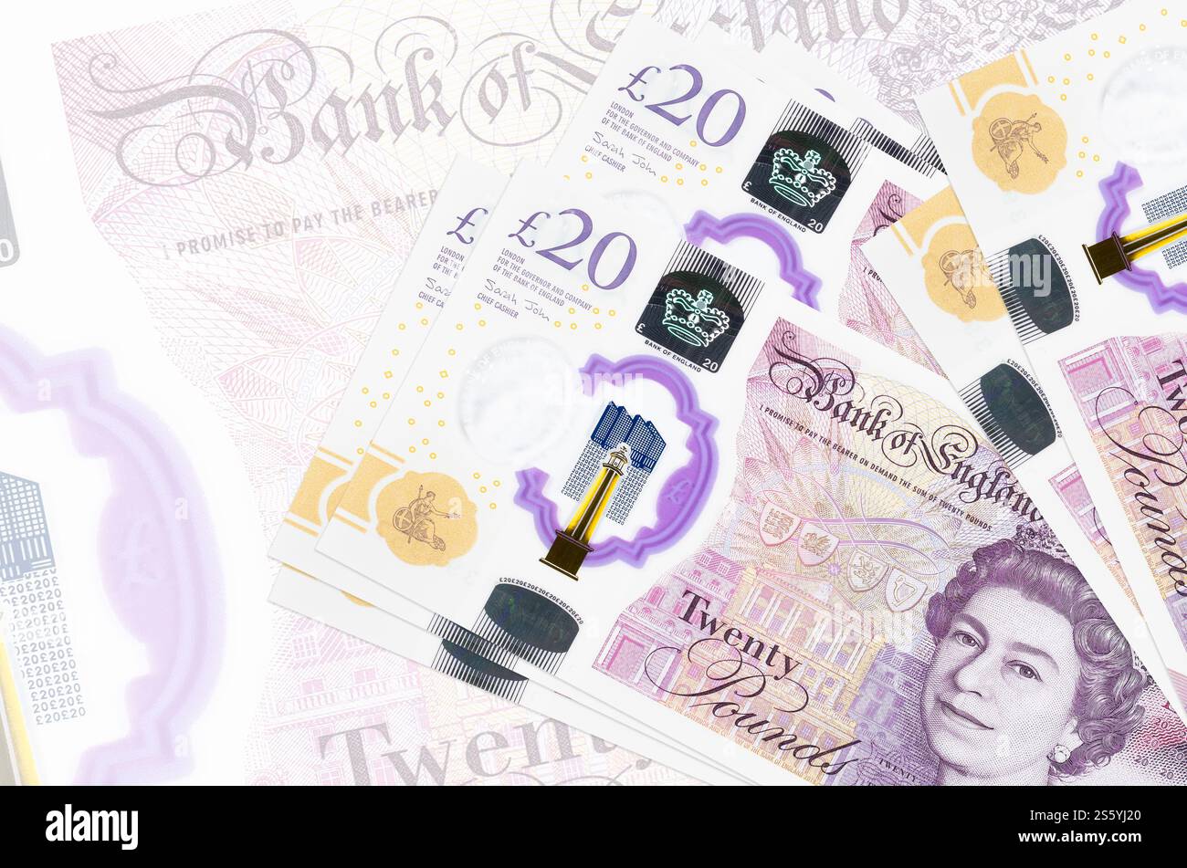 20 British pounds bills lies in stack on background of big semi ...