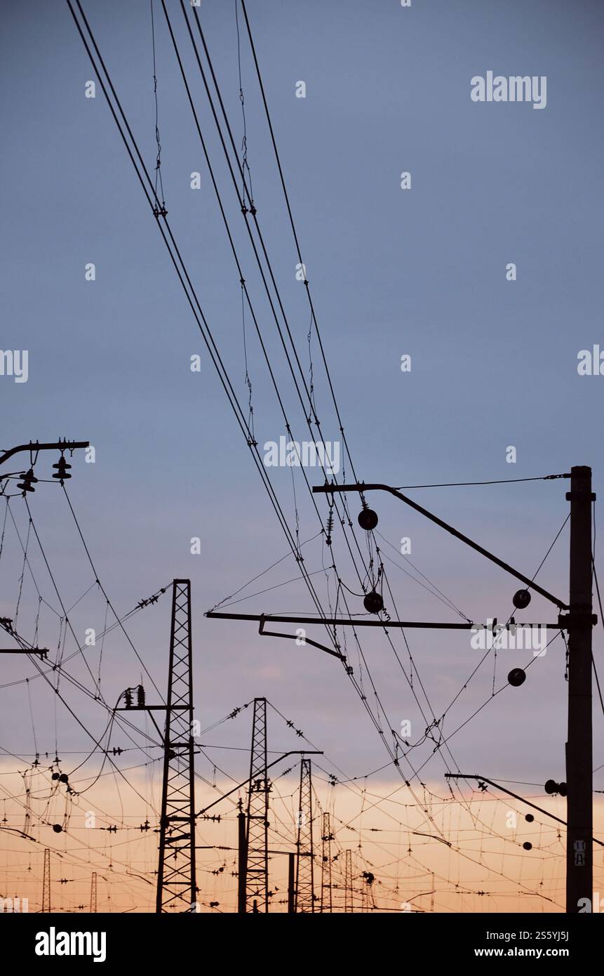 Railroad overhead lines against clear blue sky, Contact wire. High ...