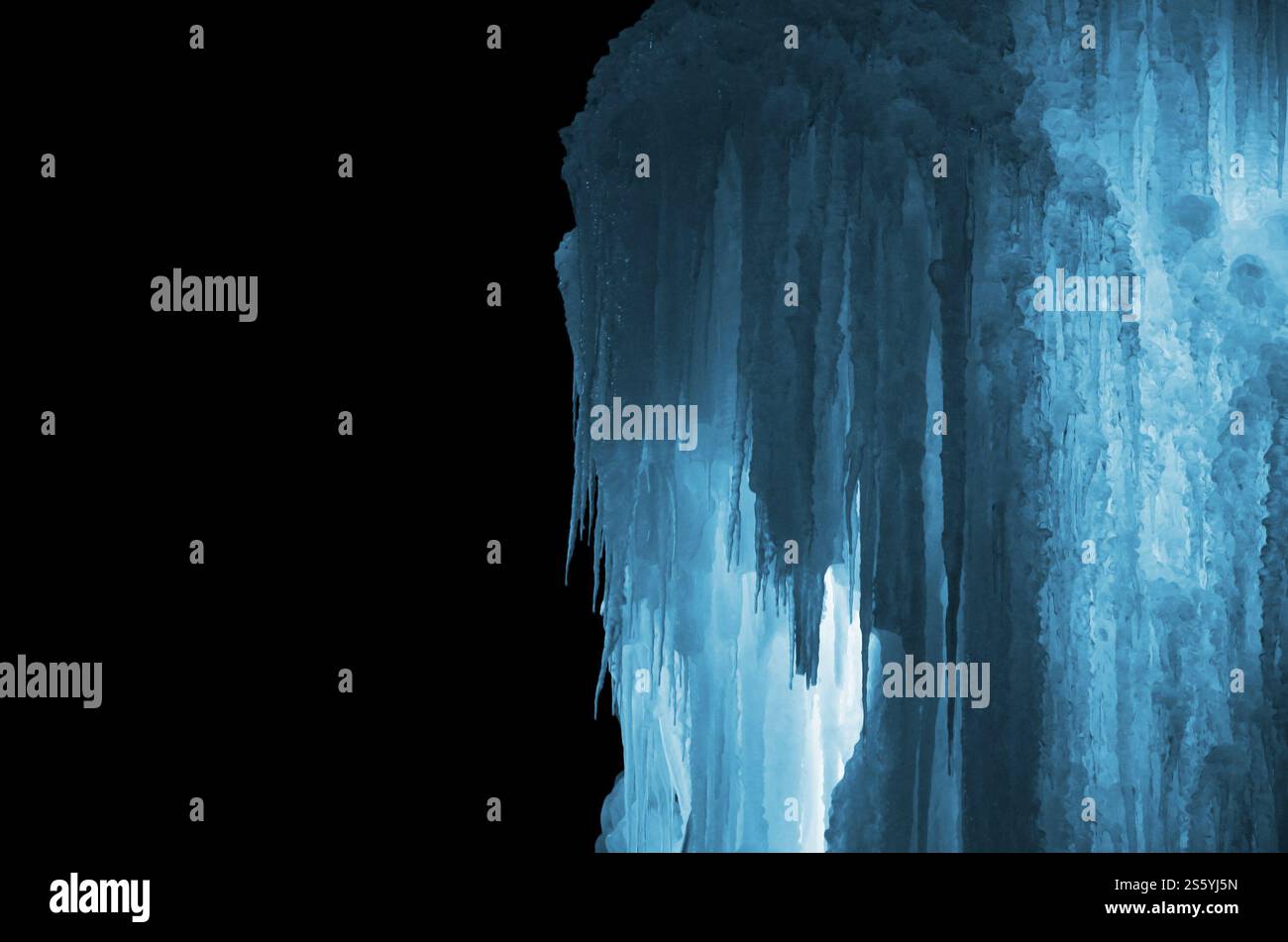Huge ice icicles. Large blocks of ice frozen waterfall or water. Blue ...
