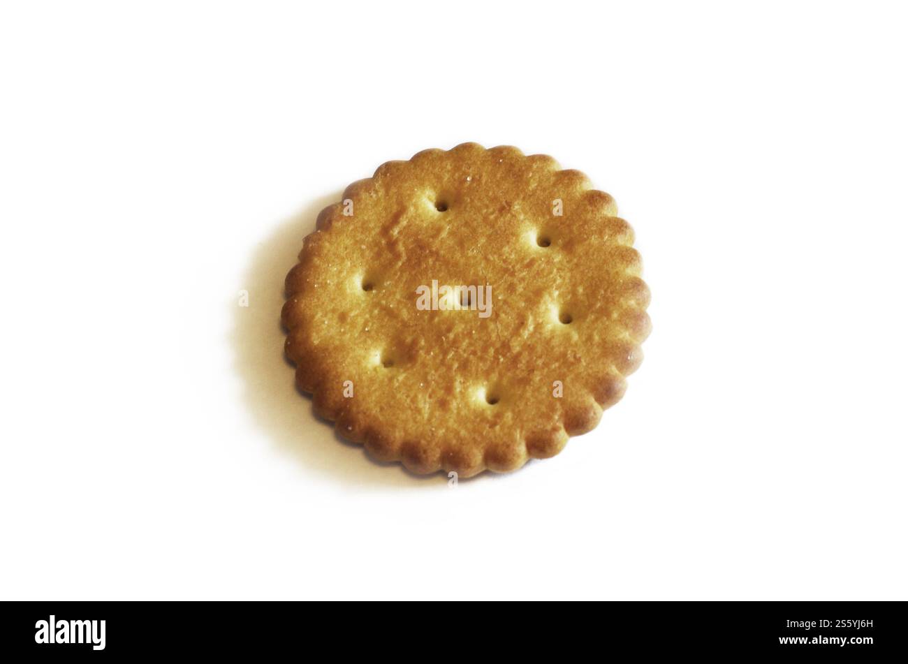 Classic round golden yellow salted cracker isolated on over white ...