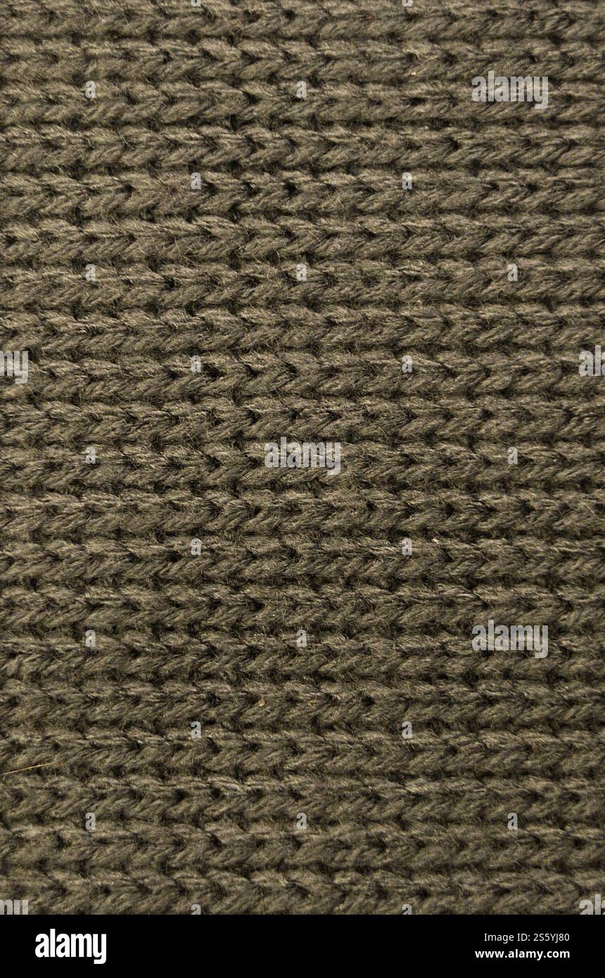 The texture of a knitted sweater wallpaper. Woolen fabric for wallpaper ...