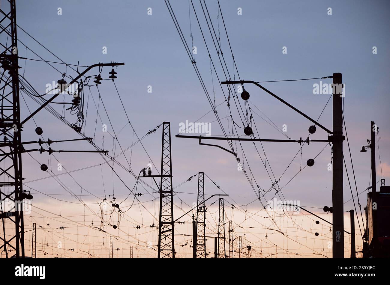 Railroad overhead lines against clear blue sky, Contact wire. High ...