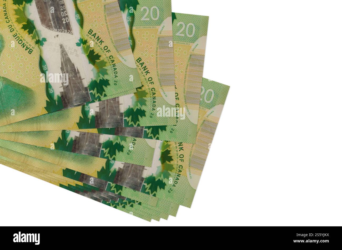 20 Canadian dollars bills lies in small bunch or pack isolated on white ...