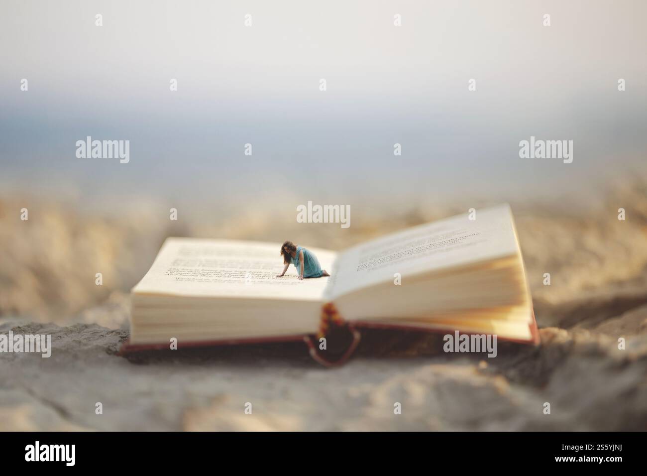 woman reading the pages of a giant book, abstract concept Stock Photo ...