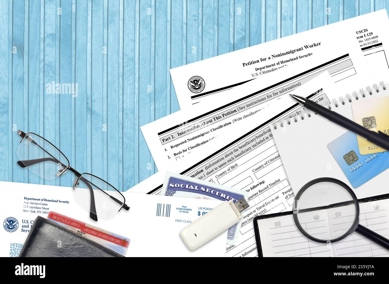 USCIS form I-129 Petition for a nonimmigrant worker lies on flat lay ...