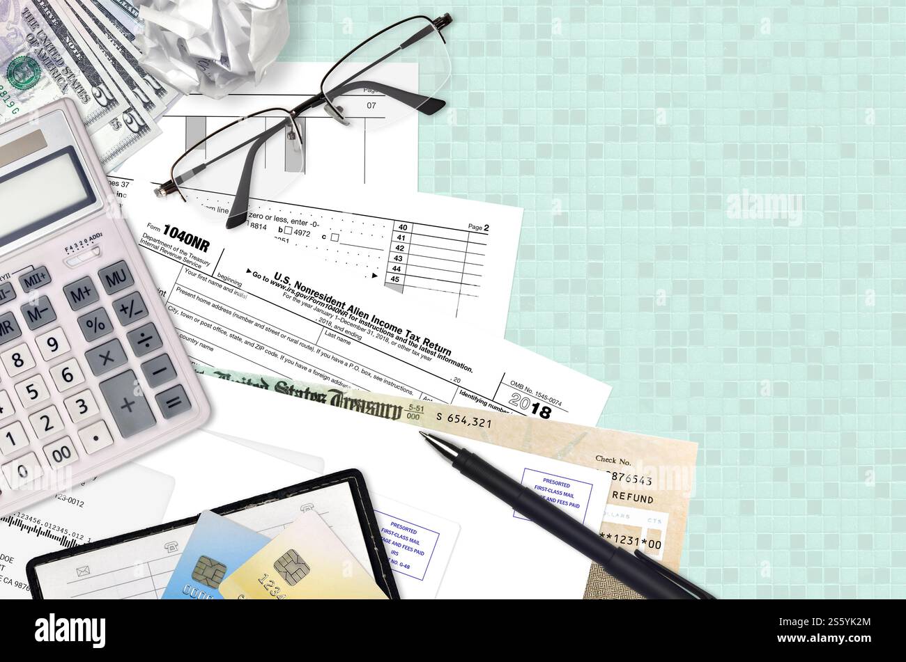 IRS form 1040NR Nonresident Alien Income tax return lies on flat lay ...