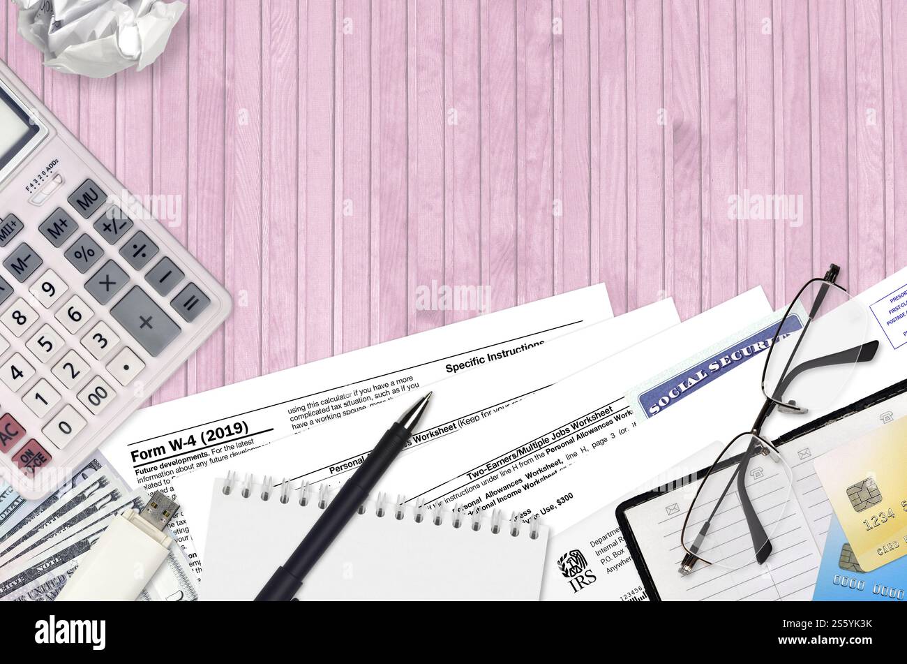 IRS form w-4 Employees Withholding Certificate lies on flat lay office ...