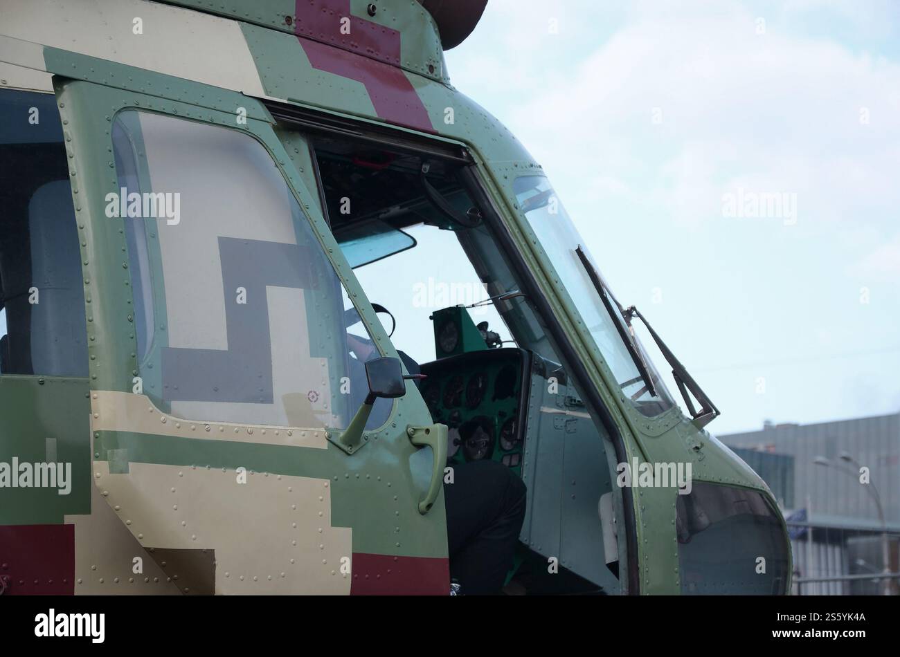 Close up view on helicopter cabin fragment. Camouflage aircraft ...