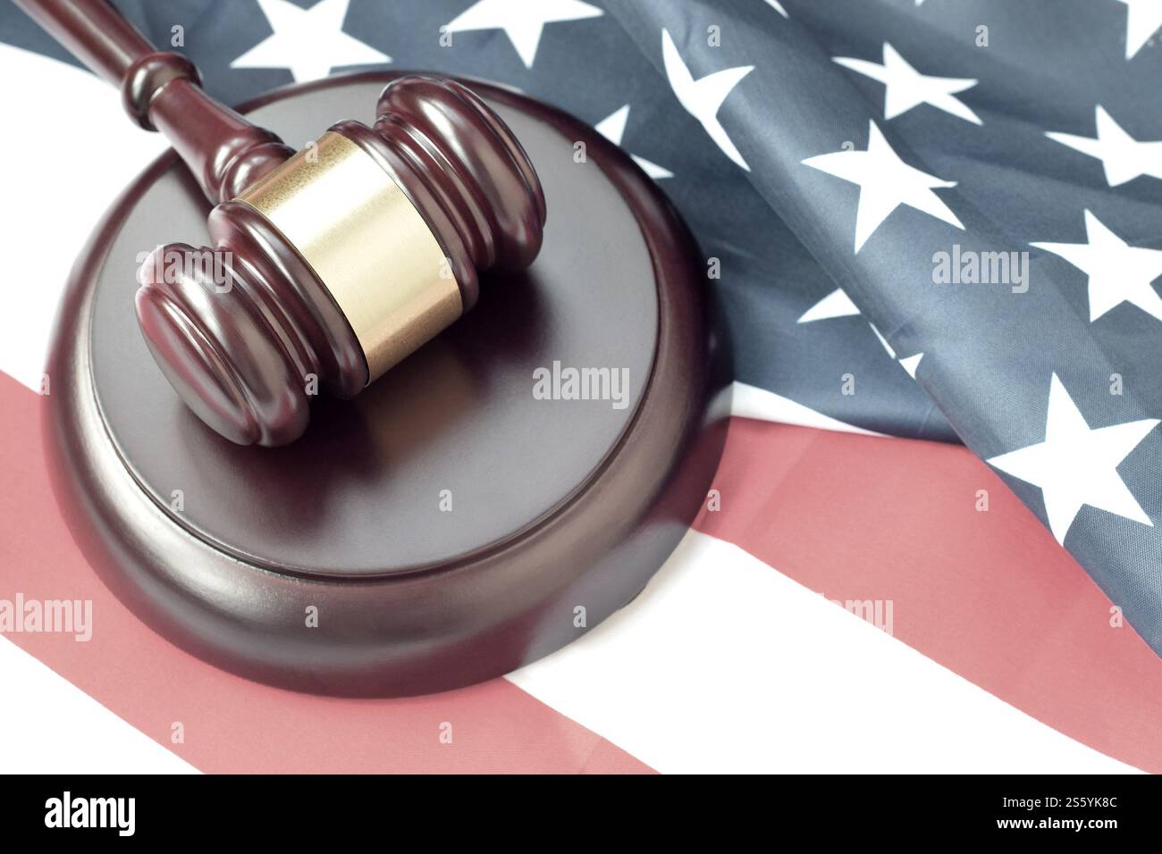Justice mallet on United States flag in a courtroom during a judicial ...
