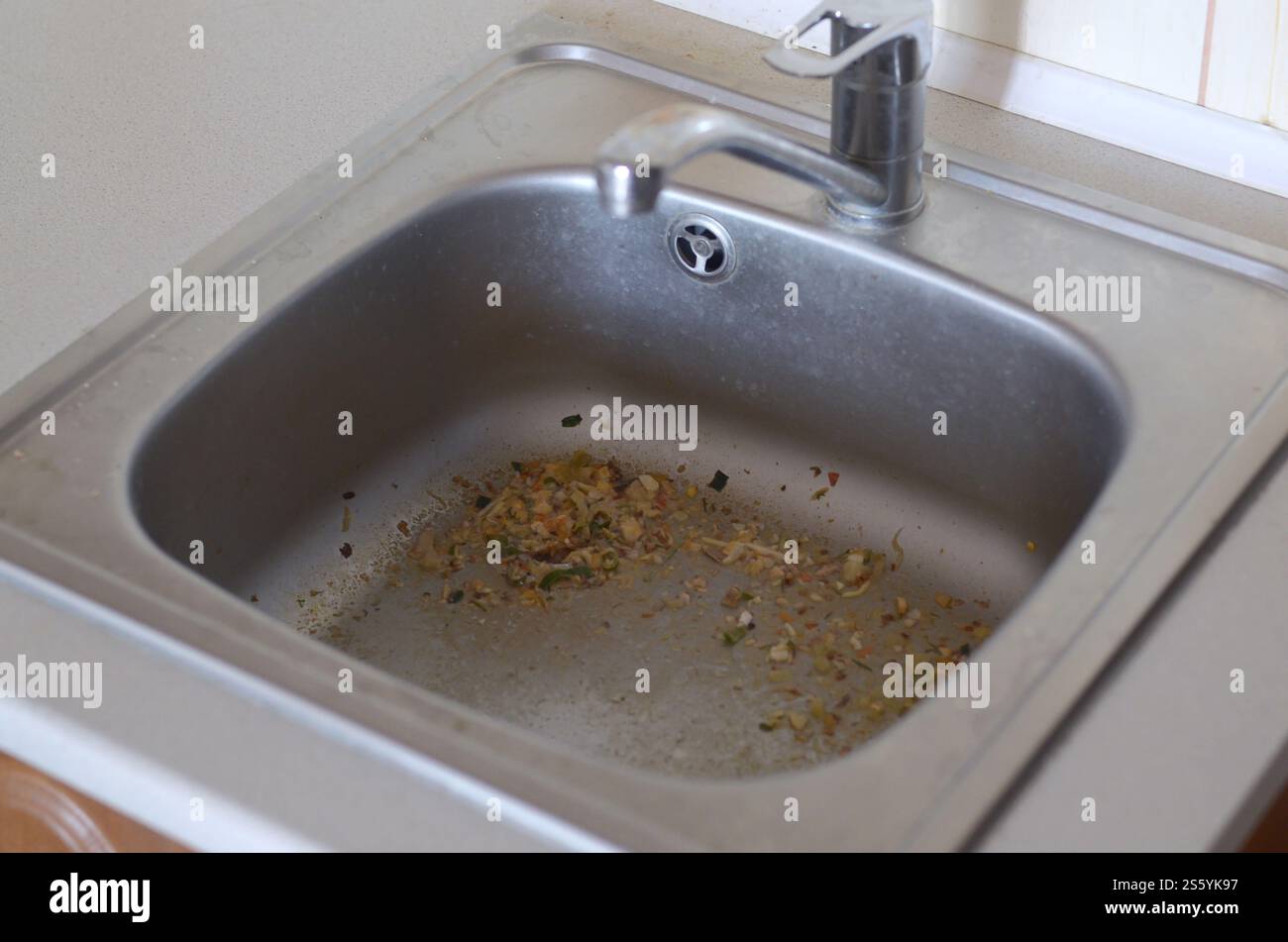 Close up on dirty clogging kitchen sink drain. Blur and selective focus ...