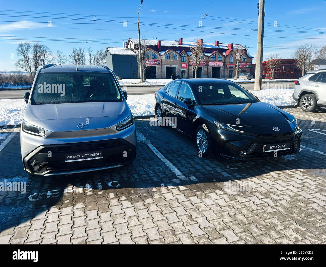 Kyiv, Ukraine - January 14, 2025: A silver Toyota minivan and a black ...