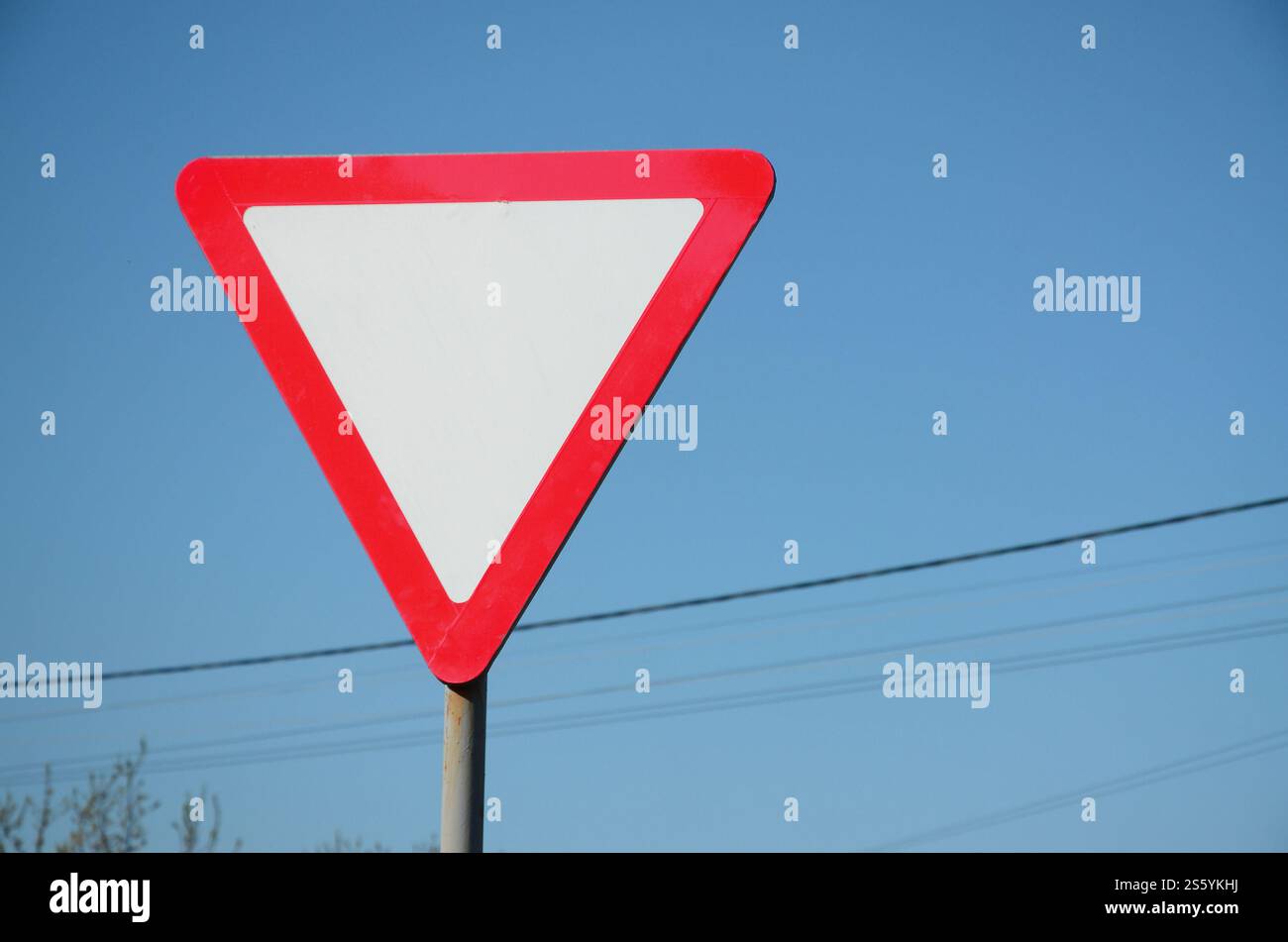 Traffic sign in the form of a white triangle. Give way symbol. Traffic ...