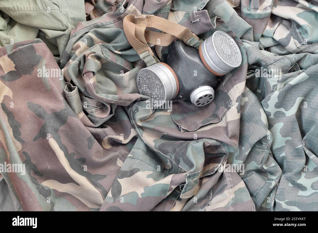 Stalker soldiers soviet gas mask lies on many green khaki camouflage ...