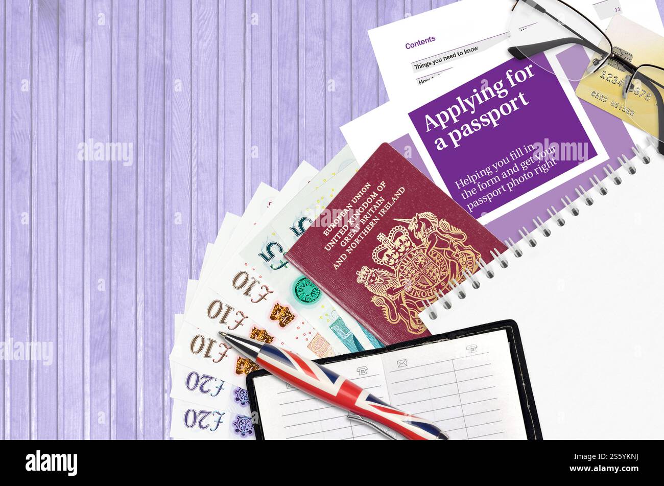 English violet guide Applying for a passport lies on table with office ...