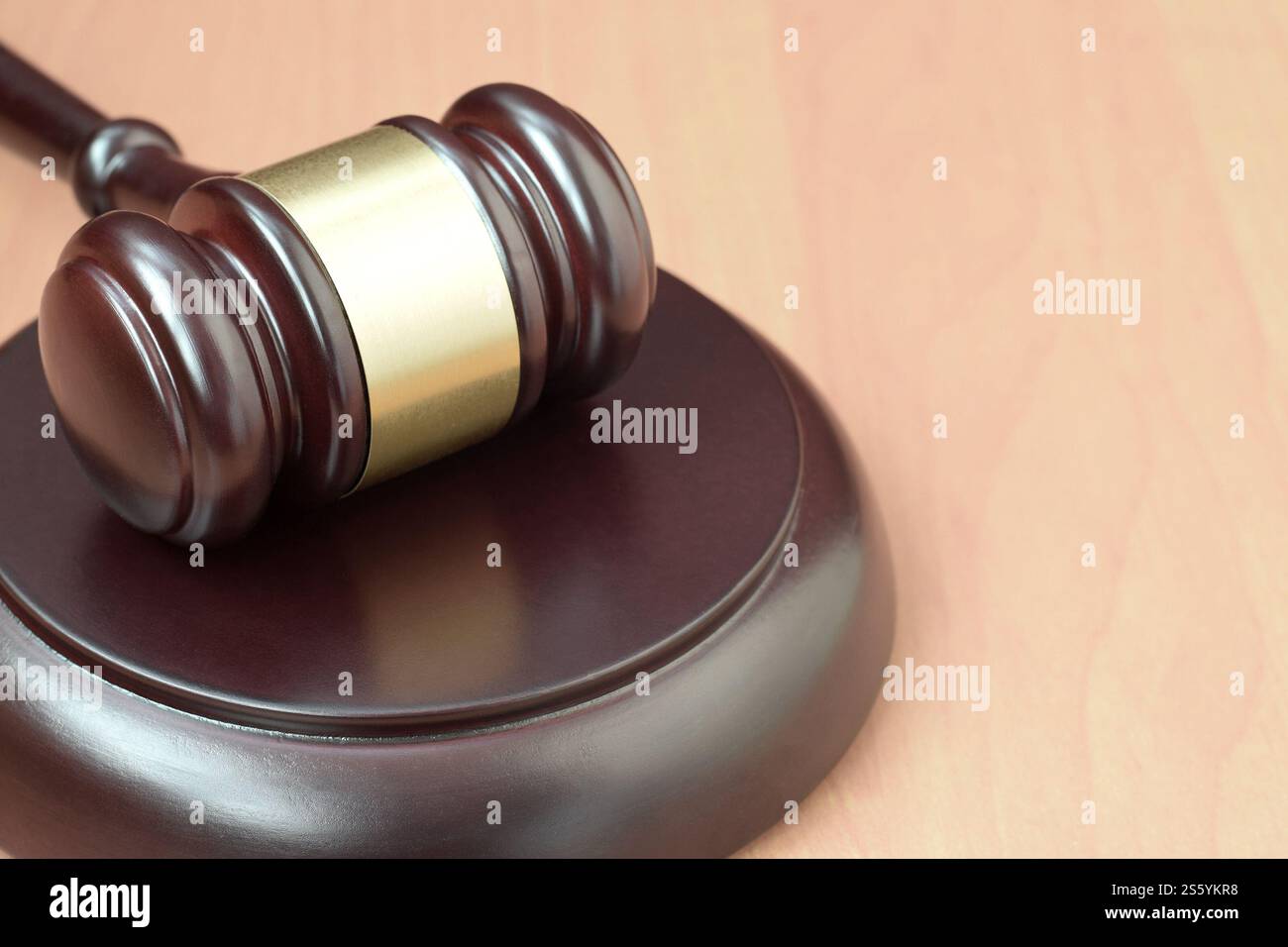 Justice mallet on wooden desk in a courtroom during a judicial trial. Law concept and empty copy ...