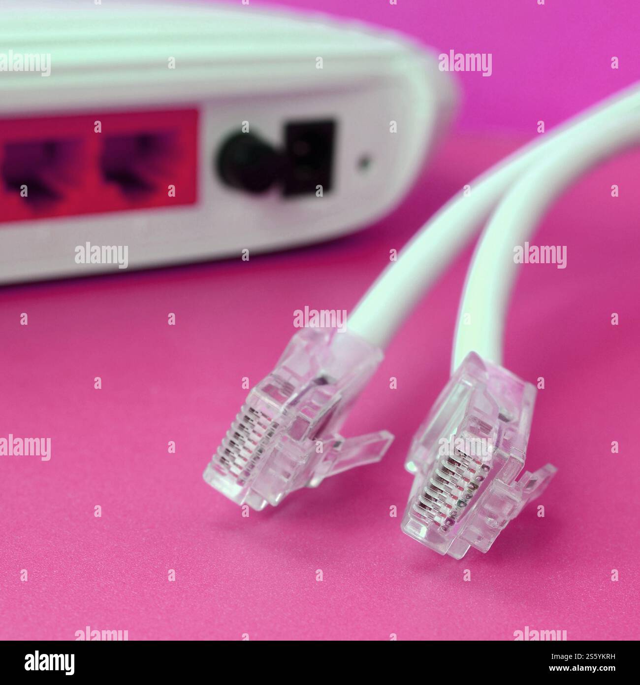 Internet Router And Internet Cable Plugs Lie On A Bright Pink Background Items Required For