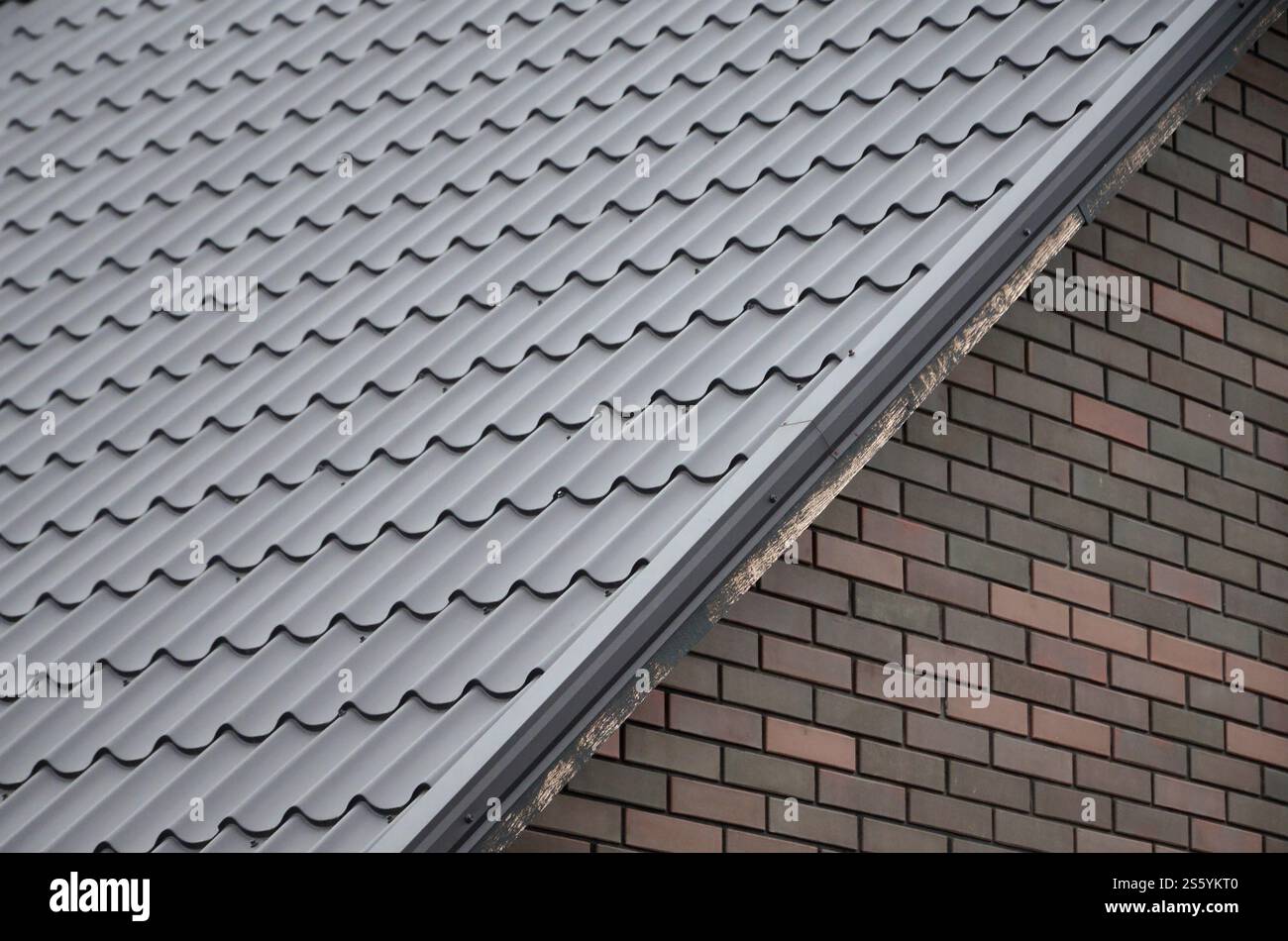 Modern brown roof made of painted metal. Corrugated metal roof and ...