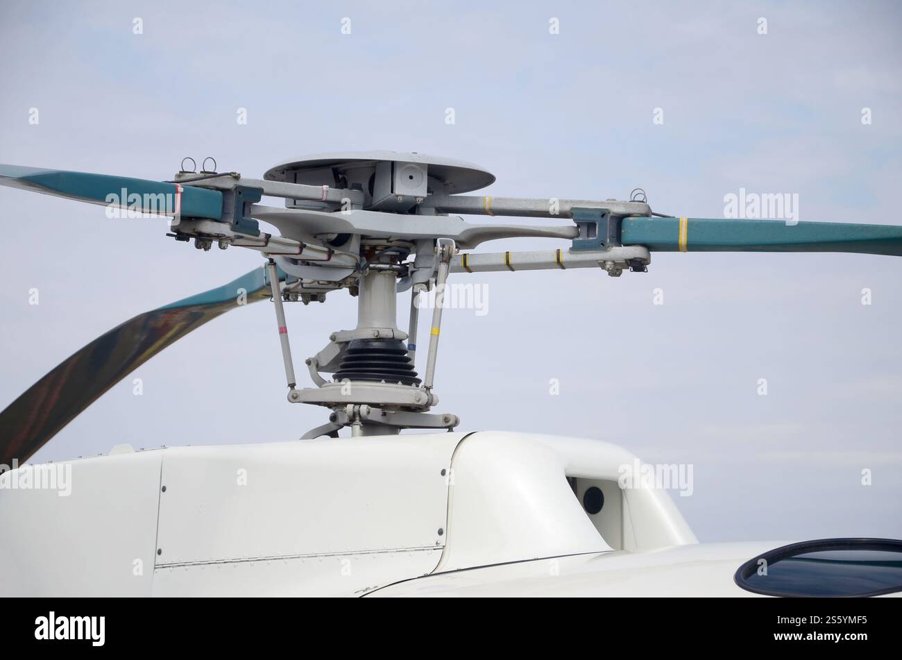 Fragment of helicopter screw engine close up against blue sky. The ...