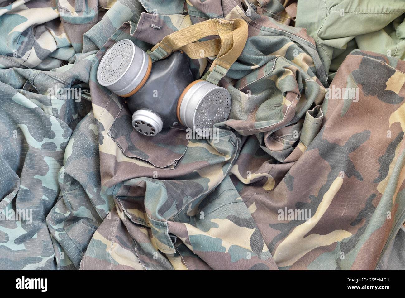 Stalker soldiers soviet gas mask lies on many green khaki camouflage ...