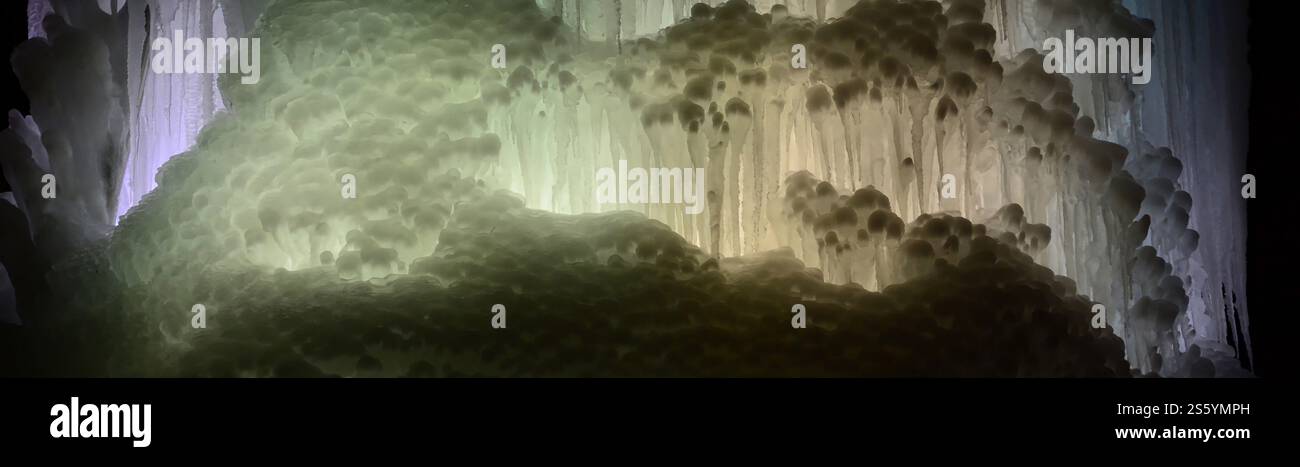 Huge ice icicles. Fragment of large blocks of ice frozen waterfall of ...