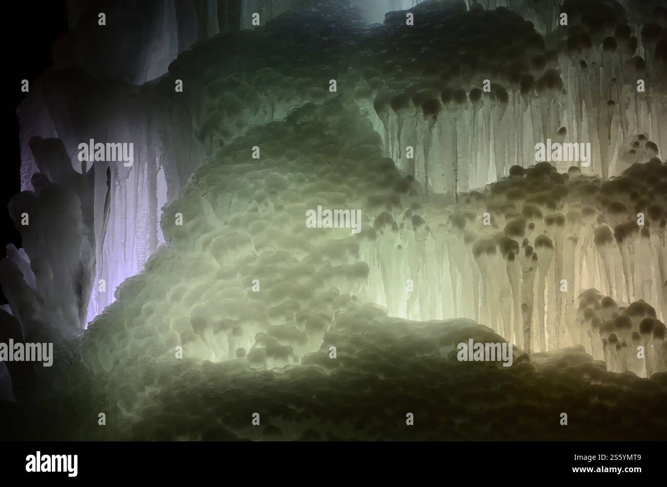 Huge ice icicles. Fragment of large blocks of ice frozen waterfall of ...