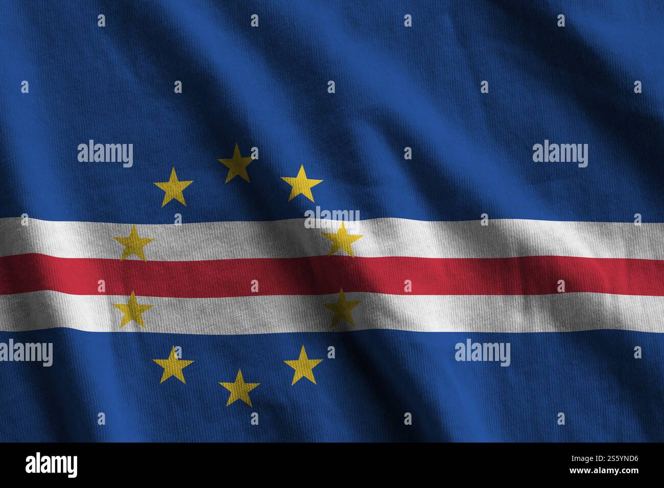 Cabo verde flag with big folds waving close up under the studio light ...