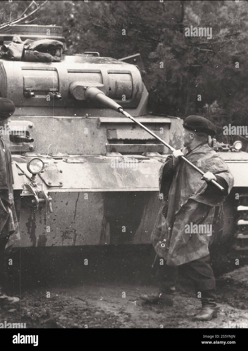A German tanker is shown cleaning the barrel of the 3.7-cm (37-mm) Kw.K ...