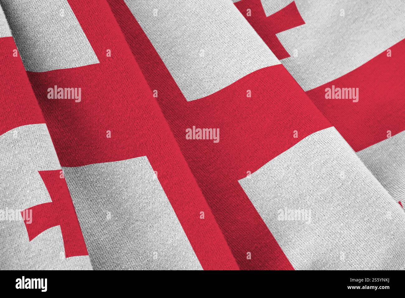 Georgia flag with big folds waving close up under the studio light ...