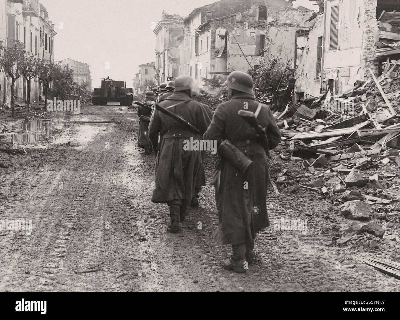 A group of German soldiers following a heavy tank Pz.Kpfw. VI «Tiger ...