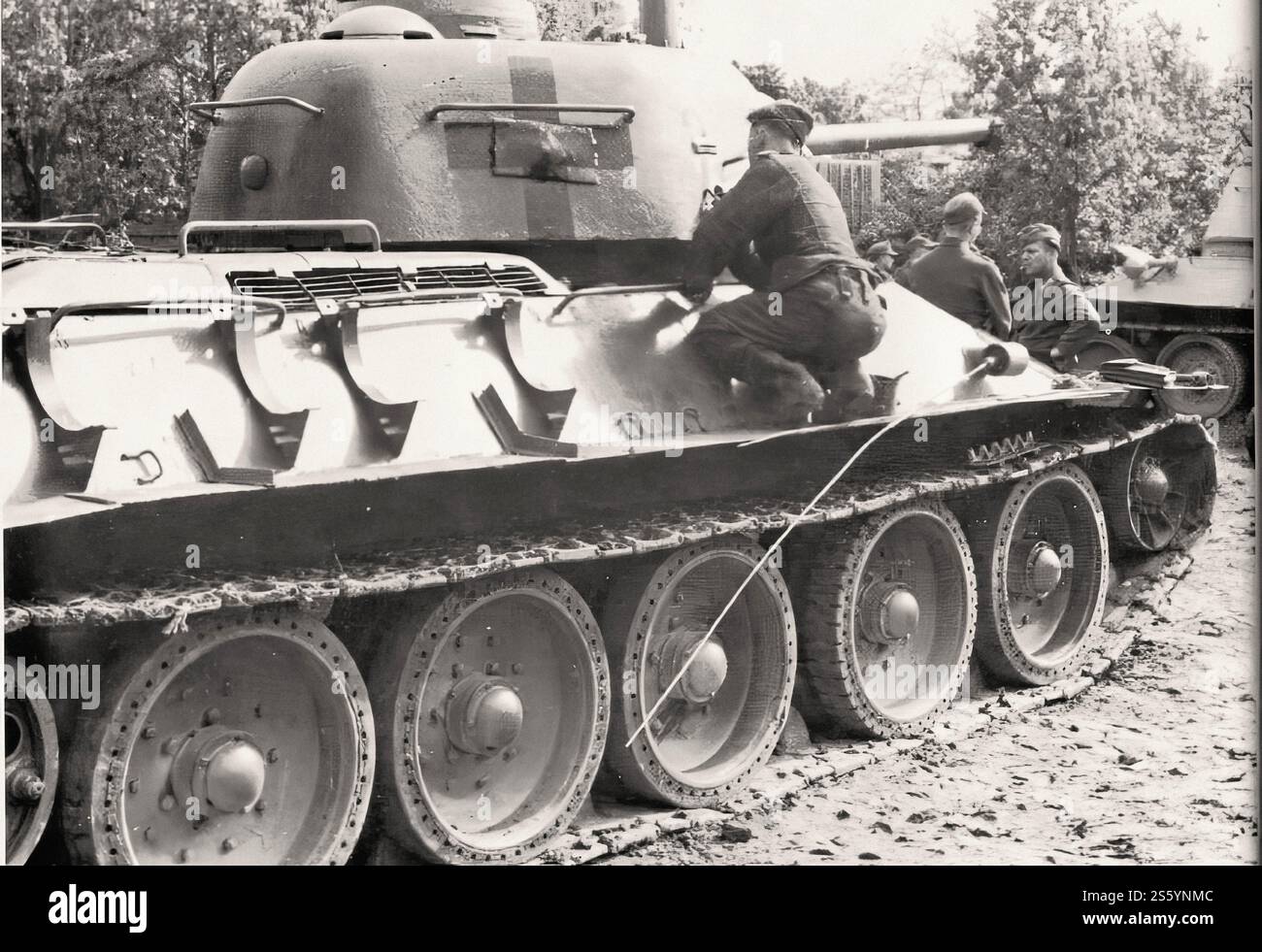 Crew of German soldiers on an armored vehicle - Beute T-34 prepared for ...