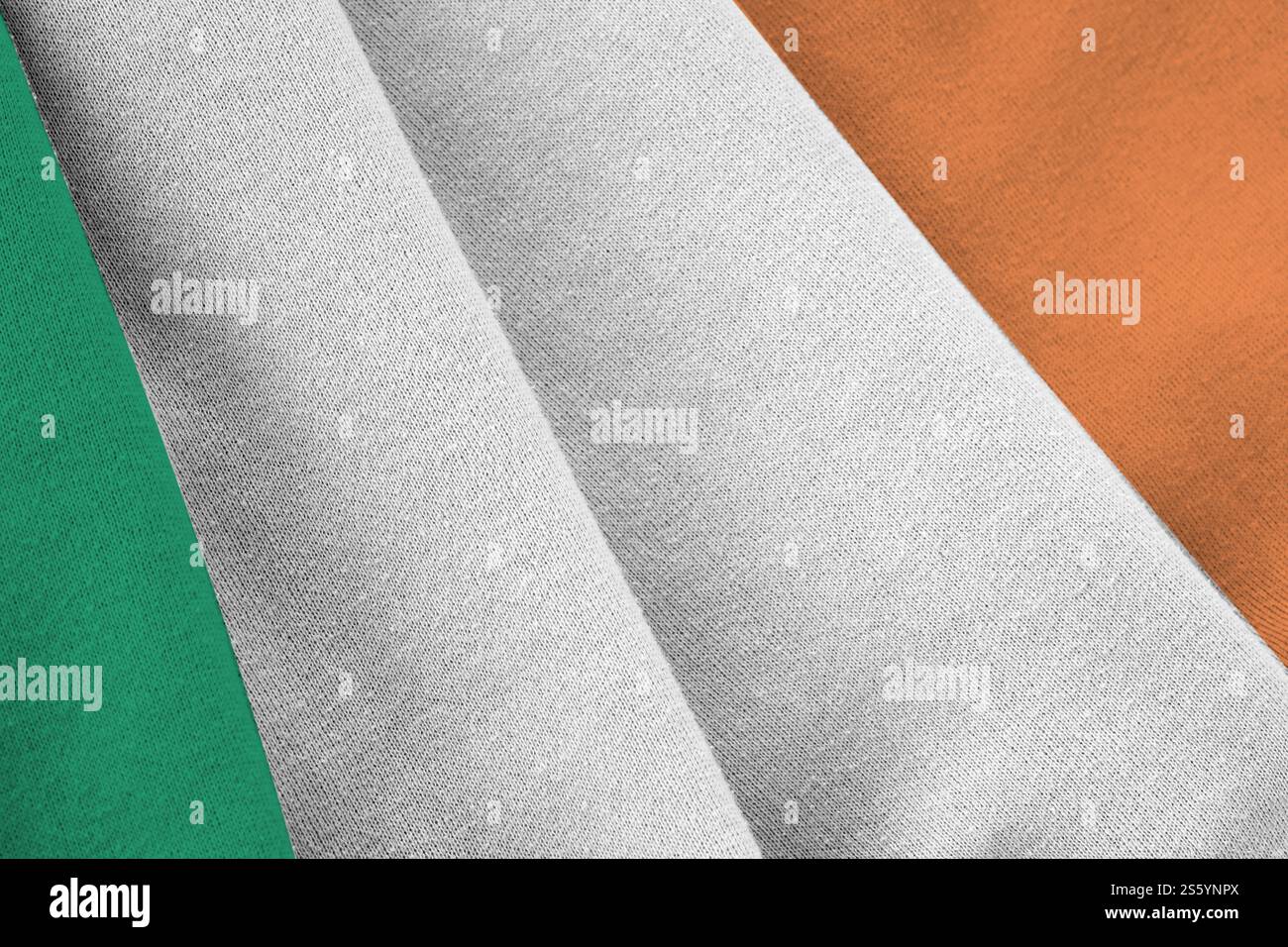 Ireland flag with big folds waving close up under the studio light ...