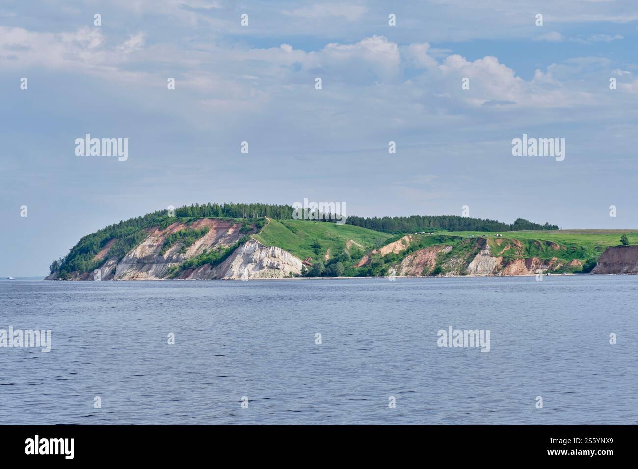 Tranquil coastal landscape. Mount Lobach greenery, white and red rocky ...