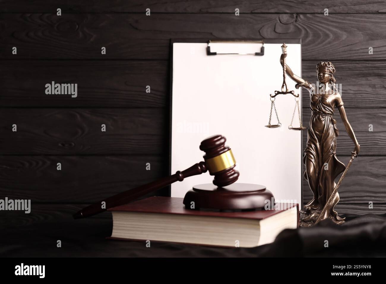 Lady justice or justitia the Roman goddess of Justice. Statue on brown ...